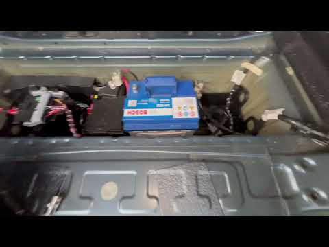 Where is the battery located and how do you reach it in an Opel Astra ...